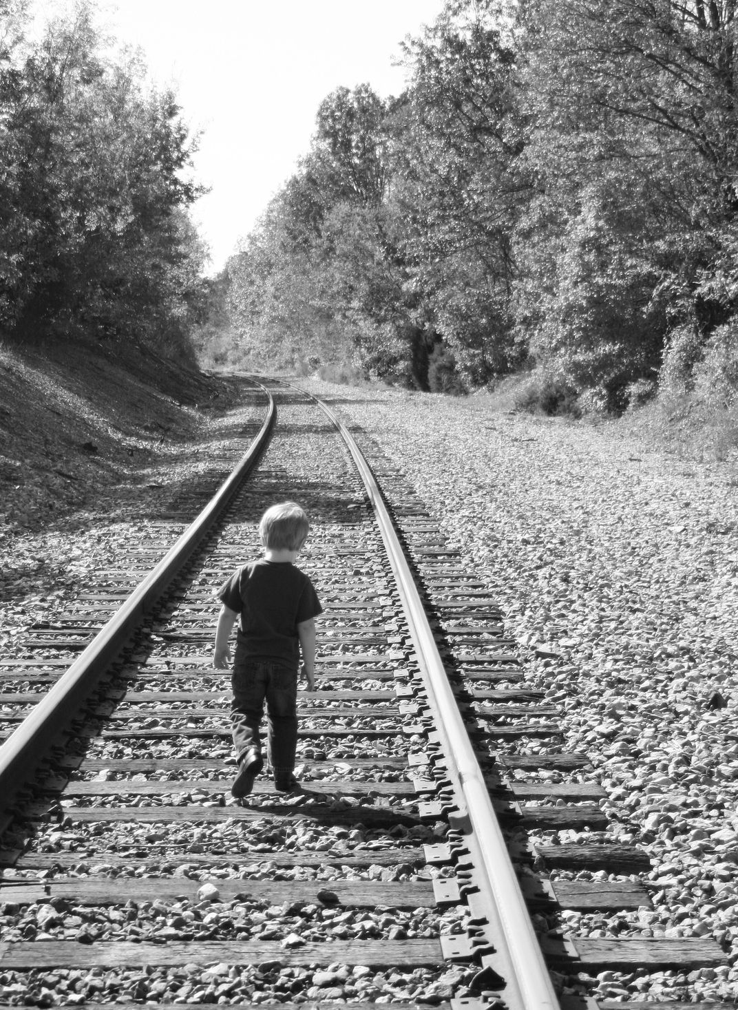 Little boy walking down railroad track | Smithsonian Photo Contest ...