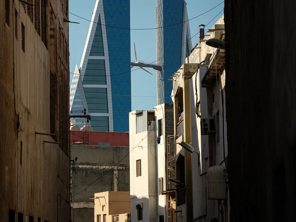 Old Manama alleyways contrasted with the rise of modern Bahrain ...