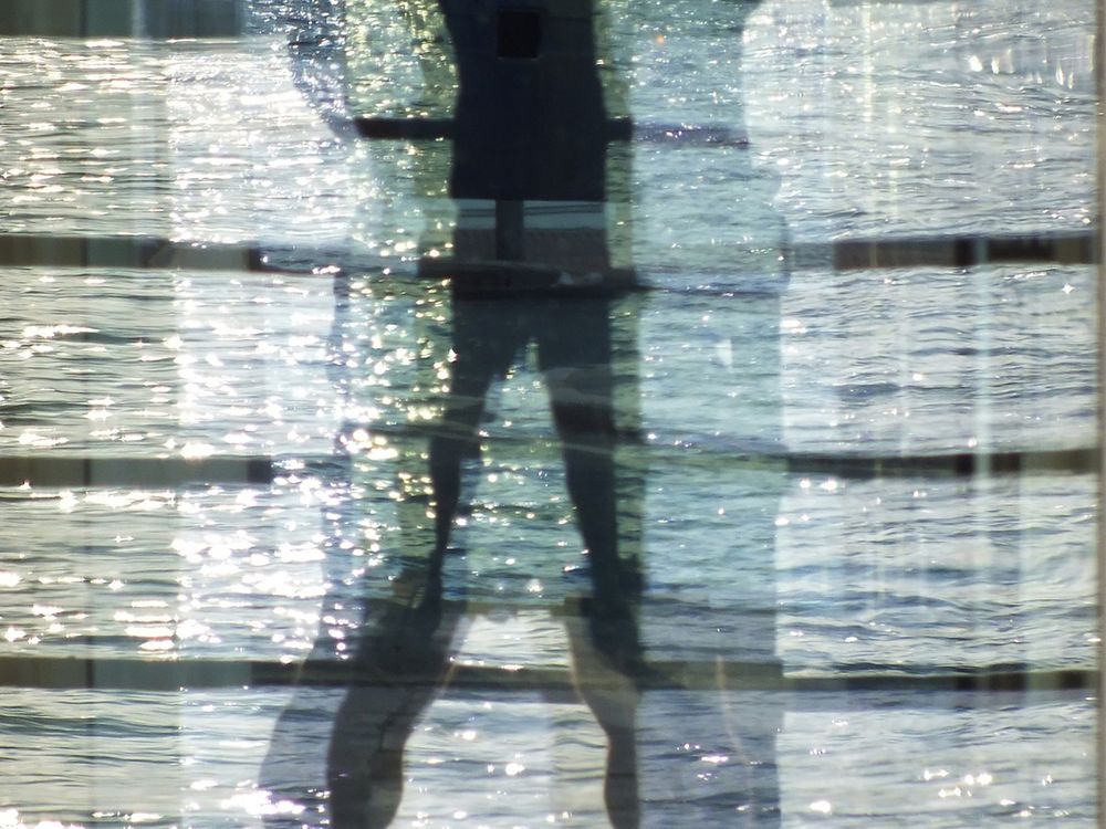 A self portrait with multiple reflections, by shooting through spaced ...