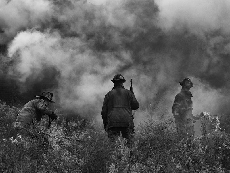 Firefighters prepare to enter a burning building in Detroit, Michigan ...