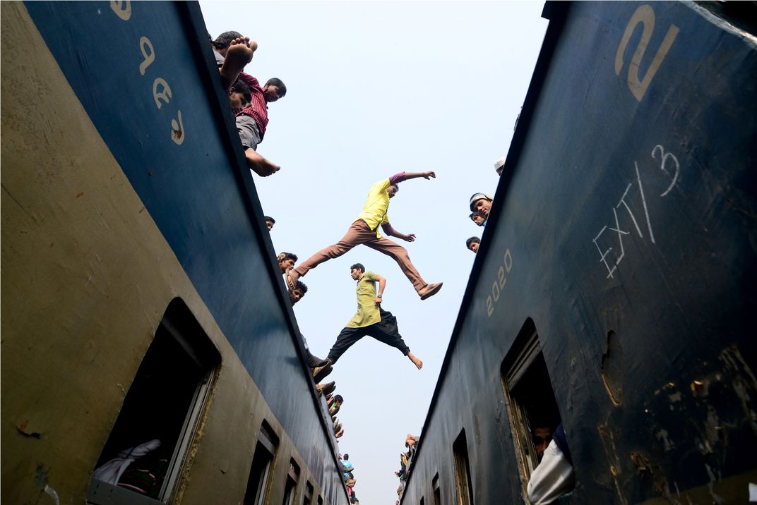 Interchanging Train Passengers of two train riding roof top and ...