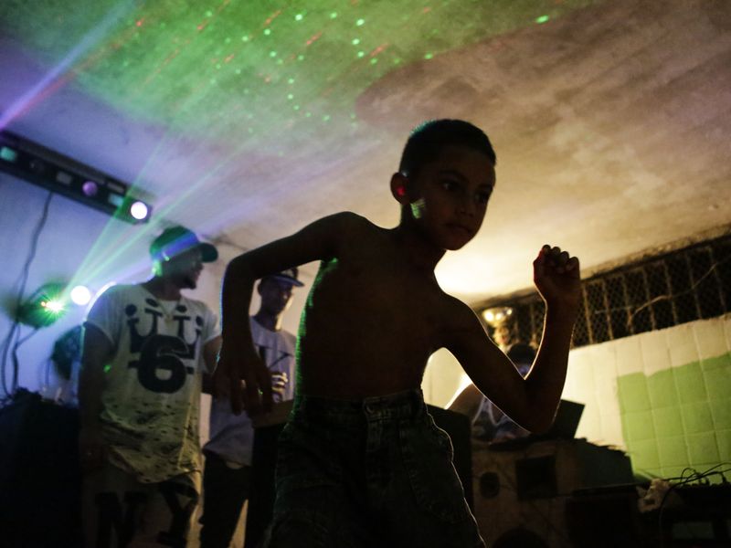 A child dances during a party in the favela of Brazil | Smithsonian ...