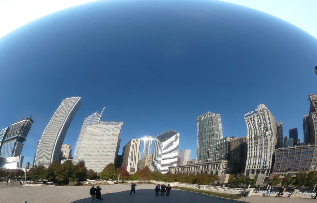 Chicago Skyline Reflected In The Cloud Gate Sculpture In Millenium