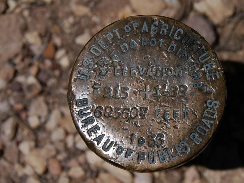 A brass survey cap benchmark, along the South Rim trail of the Grand ...