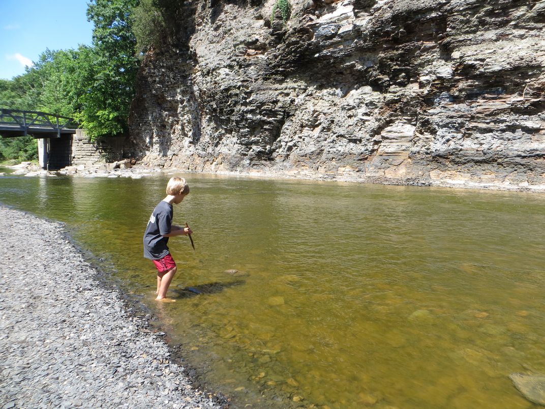 A child plays in the Vermillion River in Northern Ohio | Smithsonian ...