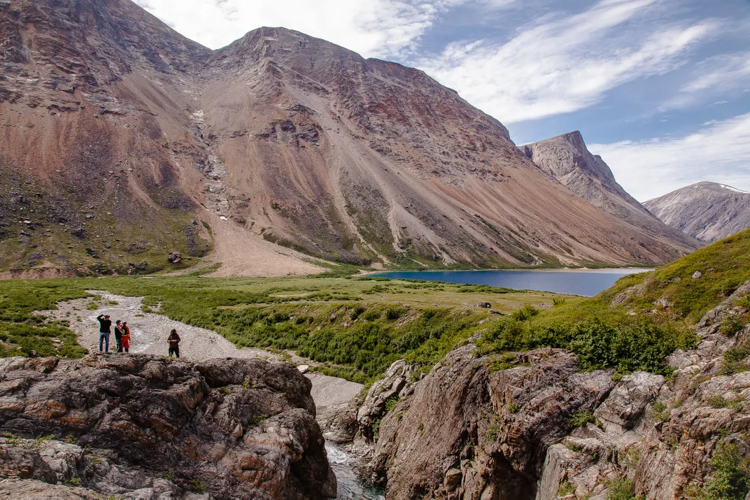 A group of hikers in the Torngat Mountains National park in northern ...