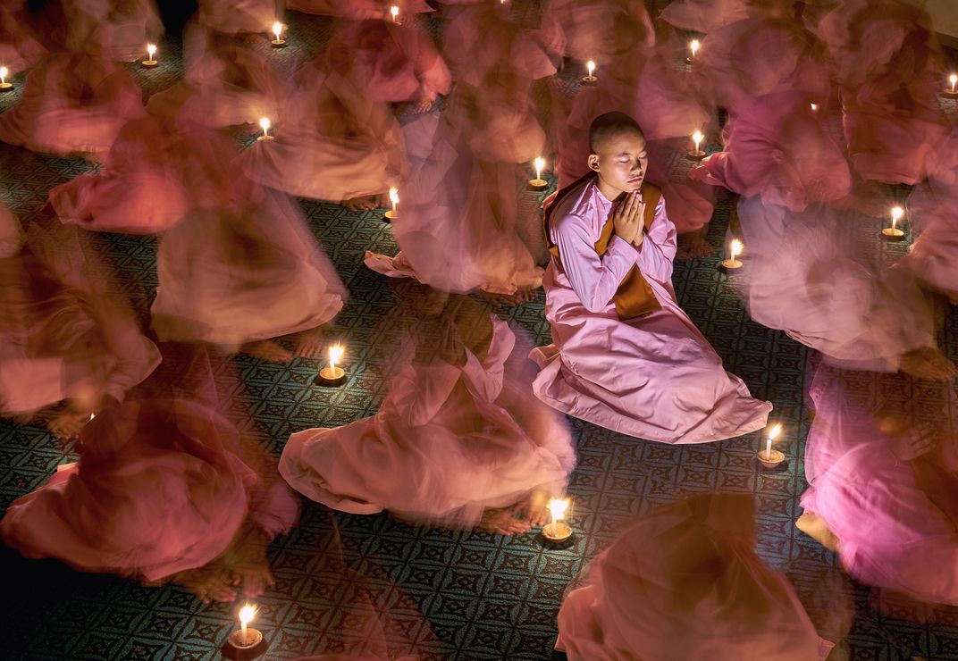 TOGETHER PRAYING WITH CANDLE LIGHT Smithsonian Photo Contest 