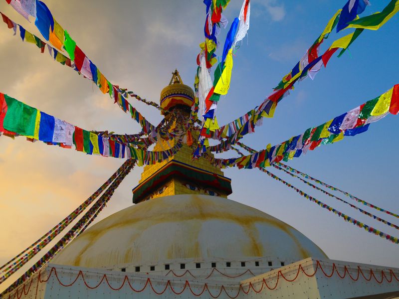 Buddhist flags connecting to the Buddha Eye at Boudhanath | Smithsonian ...