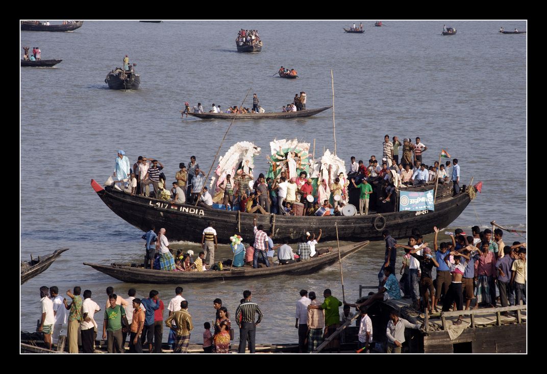 People immersing Ma Durga Idol at river Ichamati, Taki. | Smithsonian ...