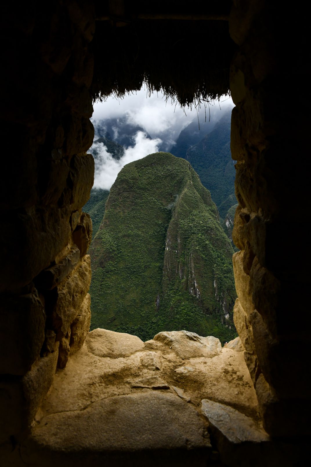 A mountain at Machu Picchu seen through a window | Smithsonian Photo ...