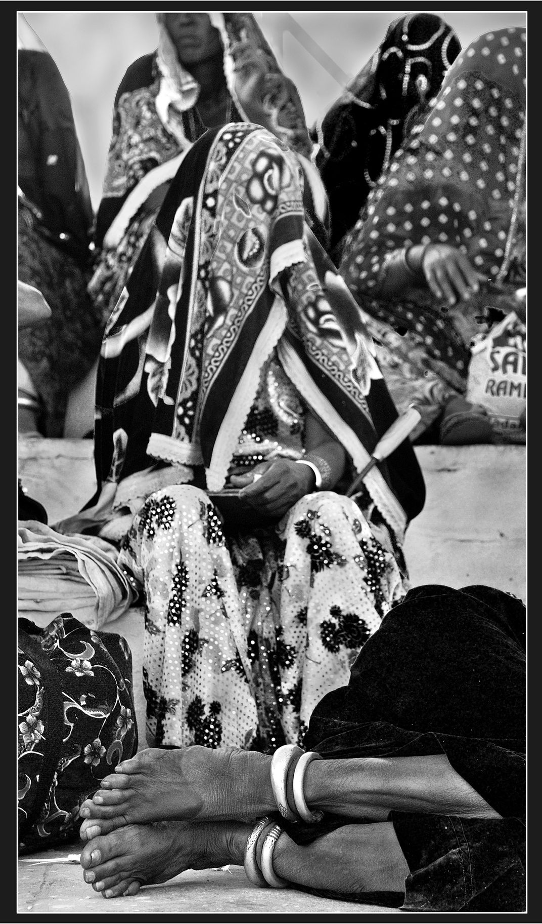 conservative women of a part of india taking rest in a break of journey ...