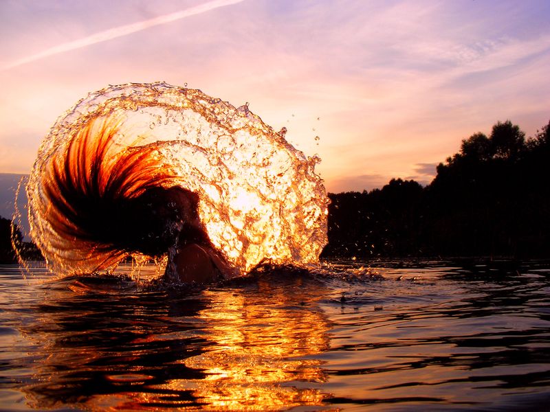 Beautiful hair flip in the water with a gorgeous sunset in the ...