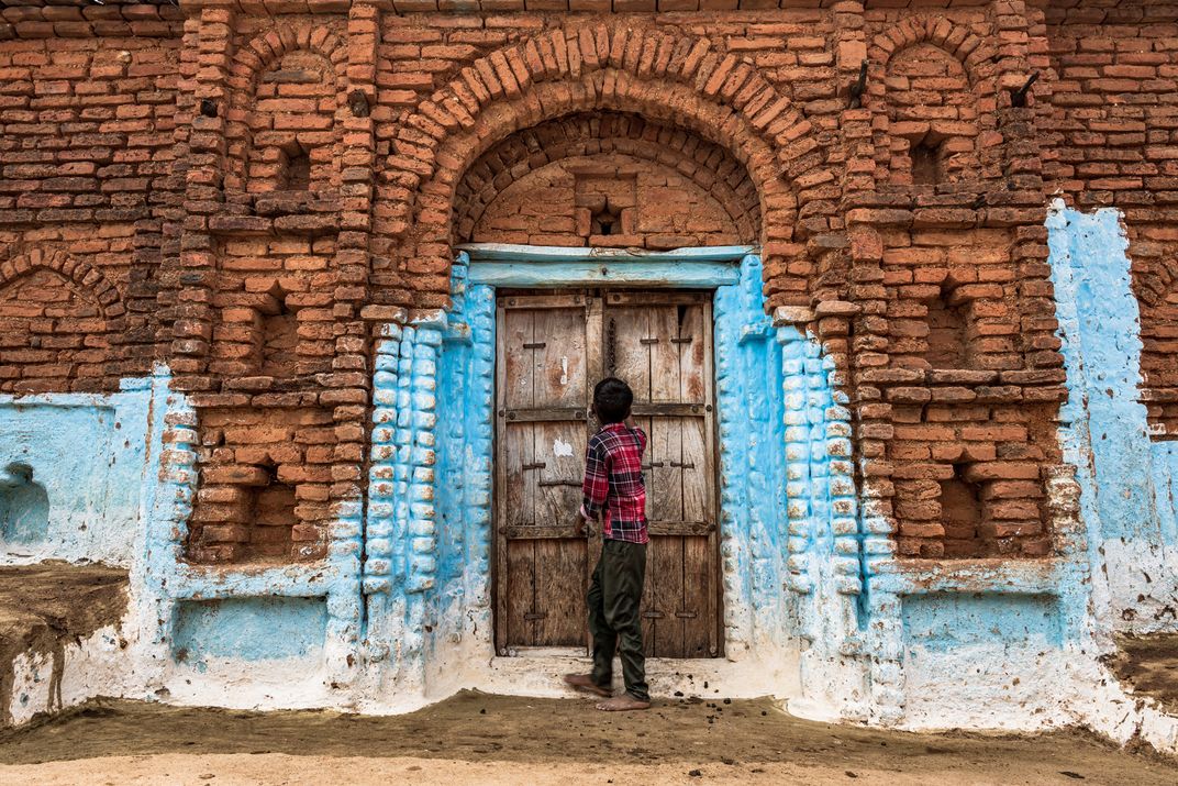 Boy And Brick Door | Smithsonian Photo Contest | Smithsonian Magazine