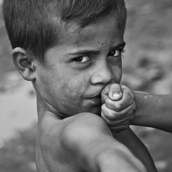 inside the gypsy settlement in Podgorica, Montenegro, there was a boy ...