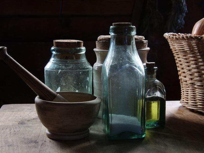 Various artifacts of the early 1800s create a still life on a table at ...
