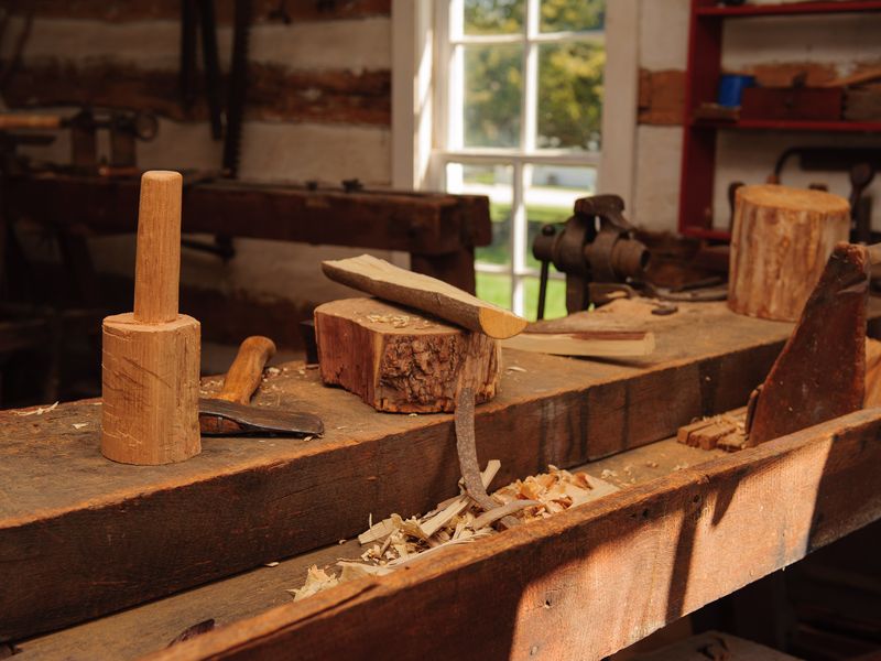 Interior of a 1850s carpenter shop including 19th century tools on the ...
