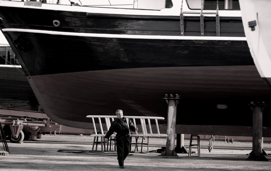 Shipwrights at the historical shipyard in Greece -12 "Under the ship ...