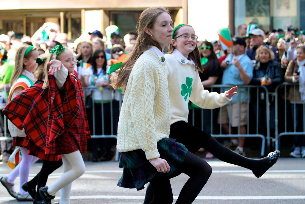 Girls kick up their heels while marching up 5th Avenue in the St ...