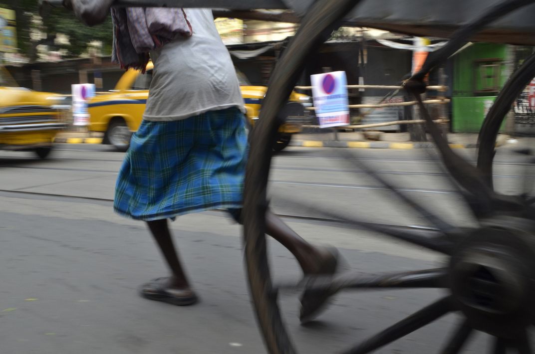 Hand Rickshaw driver pulling rickshaw with passenger. Nikon D 7000 ...
