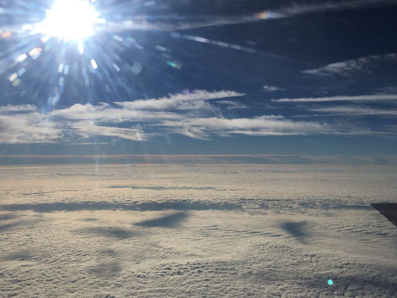 Beautiful rays of sunlight radiating from the sun in a view from an ...