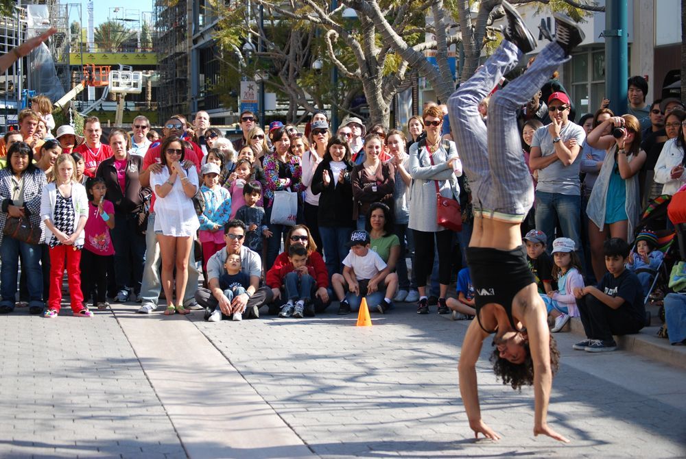 A street performer mid-handstand. | Smithsonian Photo Contest ...