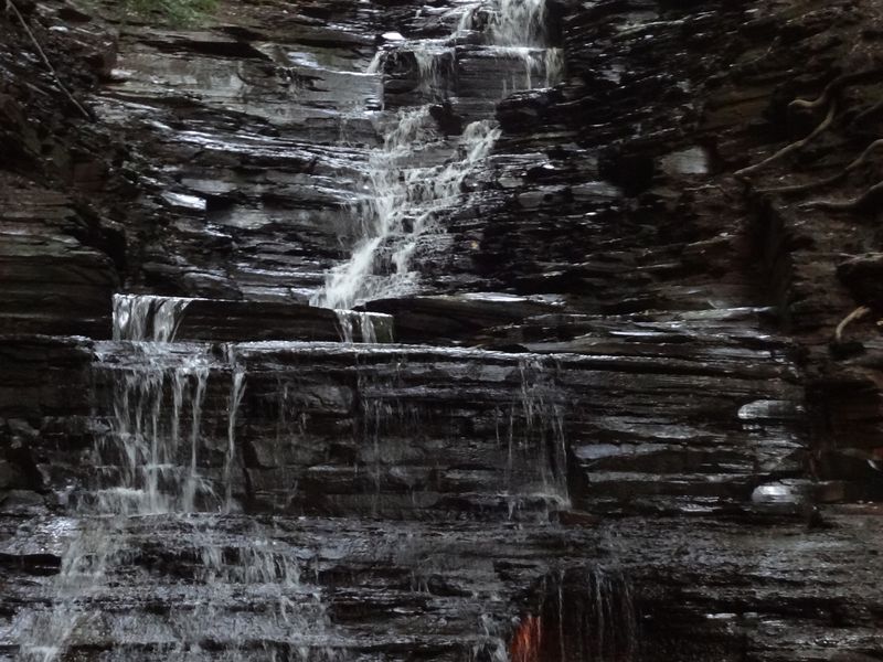 the eternal flame--a waterfall in a forest made from shale that emits ...