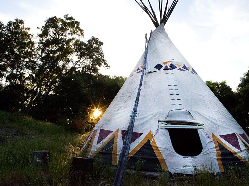 A Native American tent sits quietly on Sulphur Mountain at dusk ...
