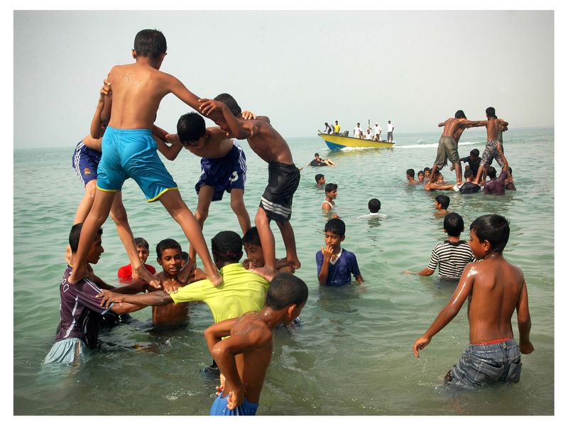 Children playing in the sea and are happiness | Smithsonian Photo ...