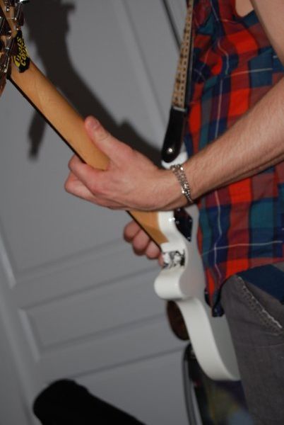 A guy tapping into the energy of the universe with his beat up guitar ...