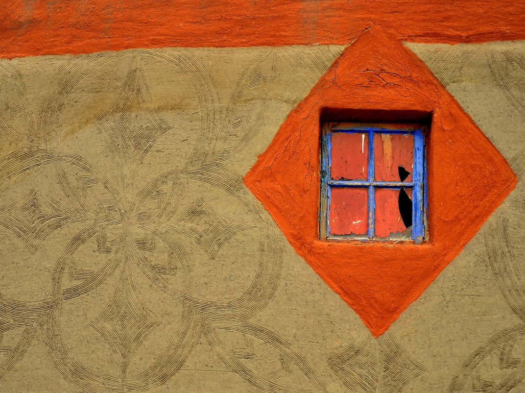 Building detail of a window and wall decorations on a Basotho ...