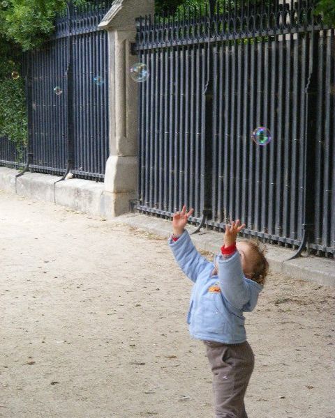 Child chasing bubbles | Smithsonian Photo Contest | Smithsonian Magazine